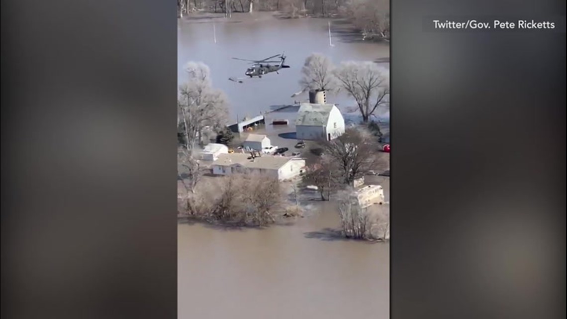 Helicopter rescue of people stranded on rooftop by widespread flooding ...