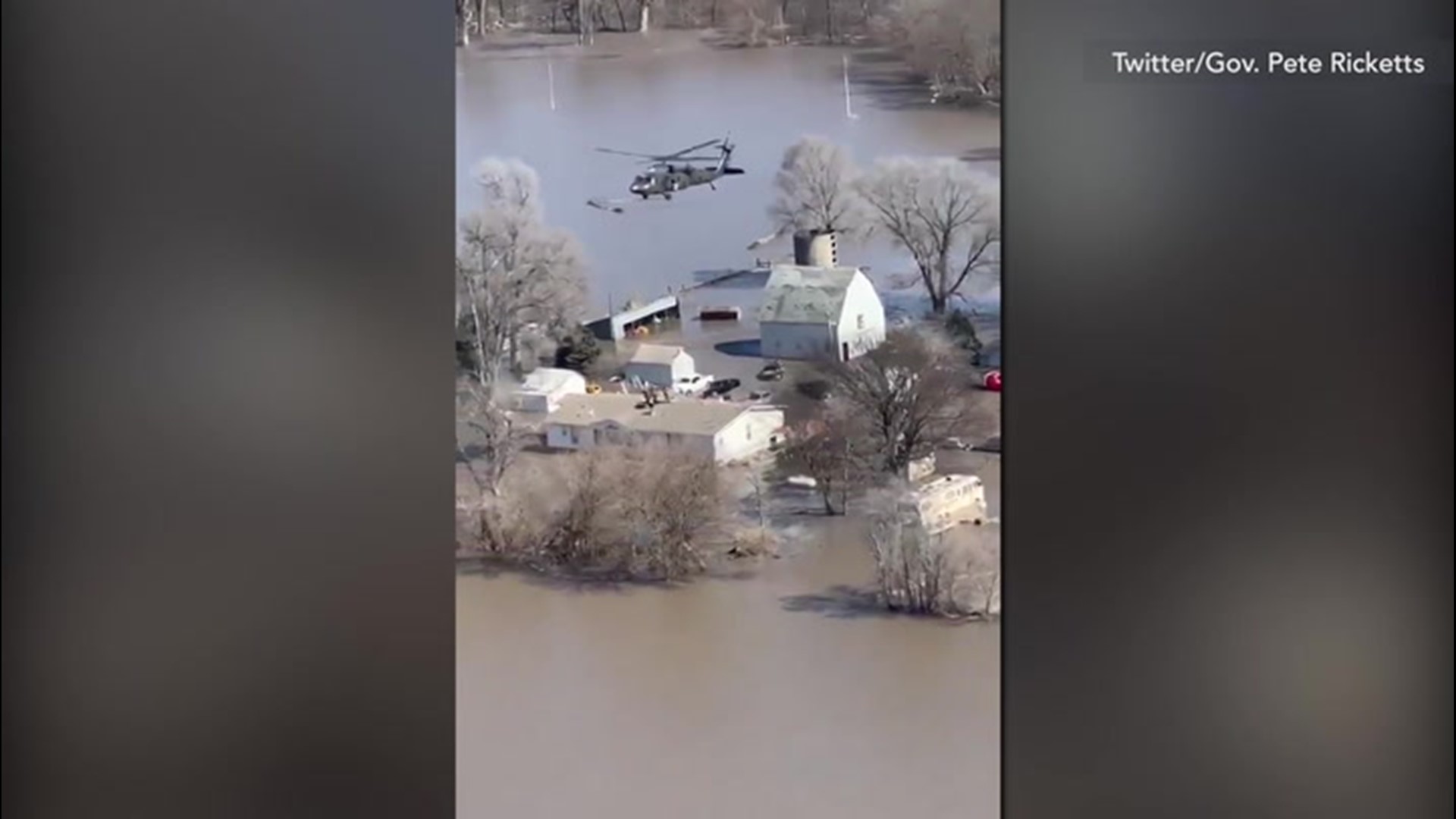 Helicopter rescue of people stranded on rooftop by widespread flooding ...