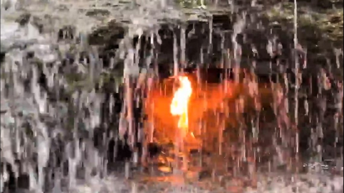 Eternal flame blazing behind waterfall | cbs19.tv
