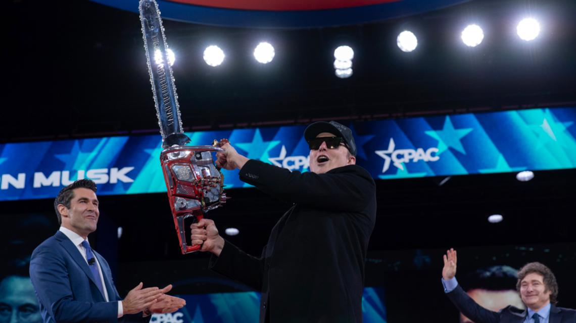 Elon Musk celebrates cuts to federal government by waving chainsaw at ...